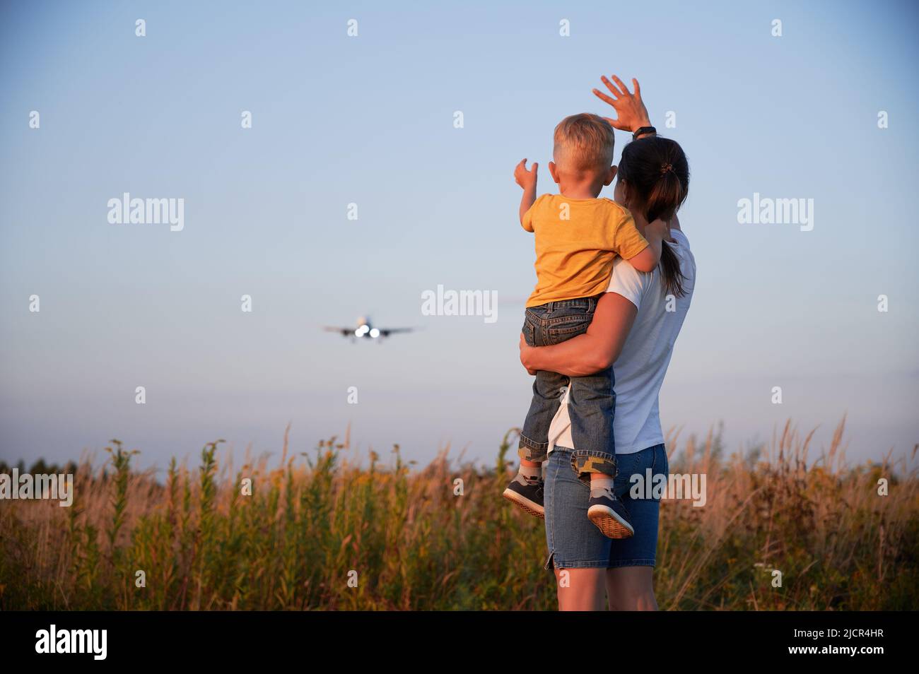 Boy waving goodbye hi-res stock photography and images - Alamy