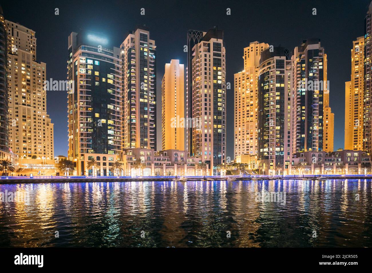 Night view of high-rise buildings of residential district in Dubai ...