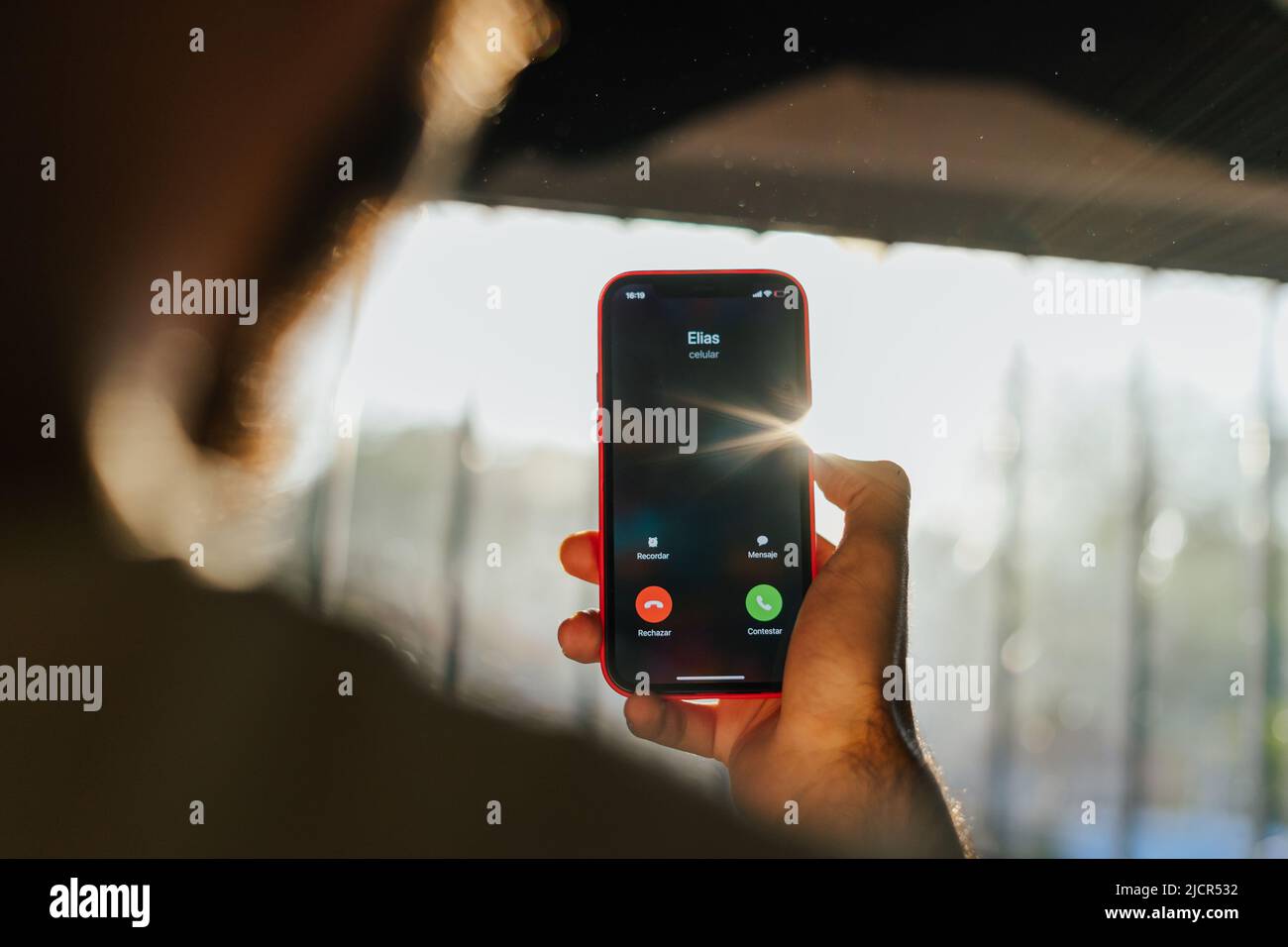 Person looking for a number among his phone contacts. Calling clients ...