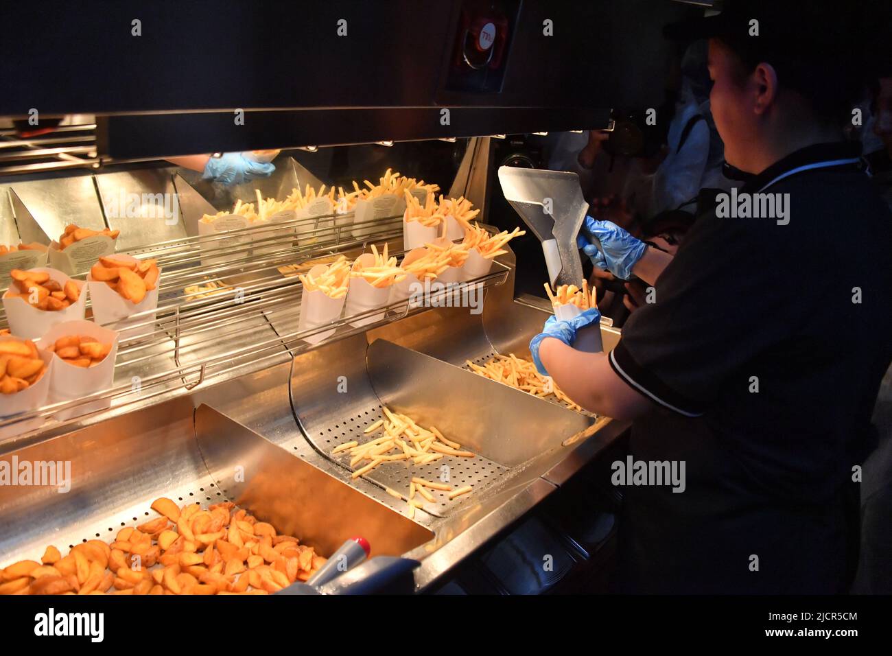 Moscow. The employee of the fast food restaurant of new network 'Tasty ...