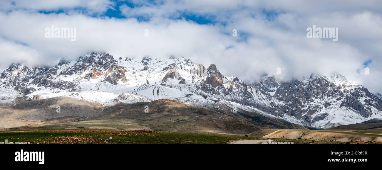 Panoramic view of snow covered peaks of the Demirkazık Tepe in the ...