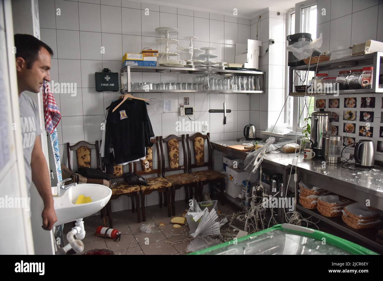 Zolochiv, Ukraine. 14th June, 2022. A man examines damage to the ...