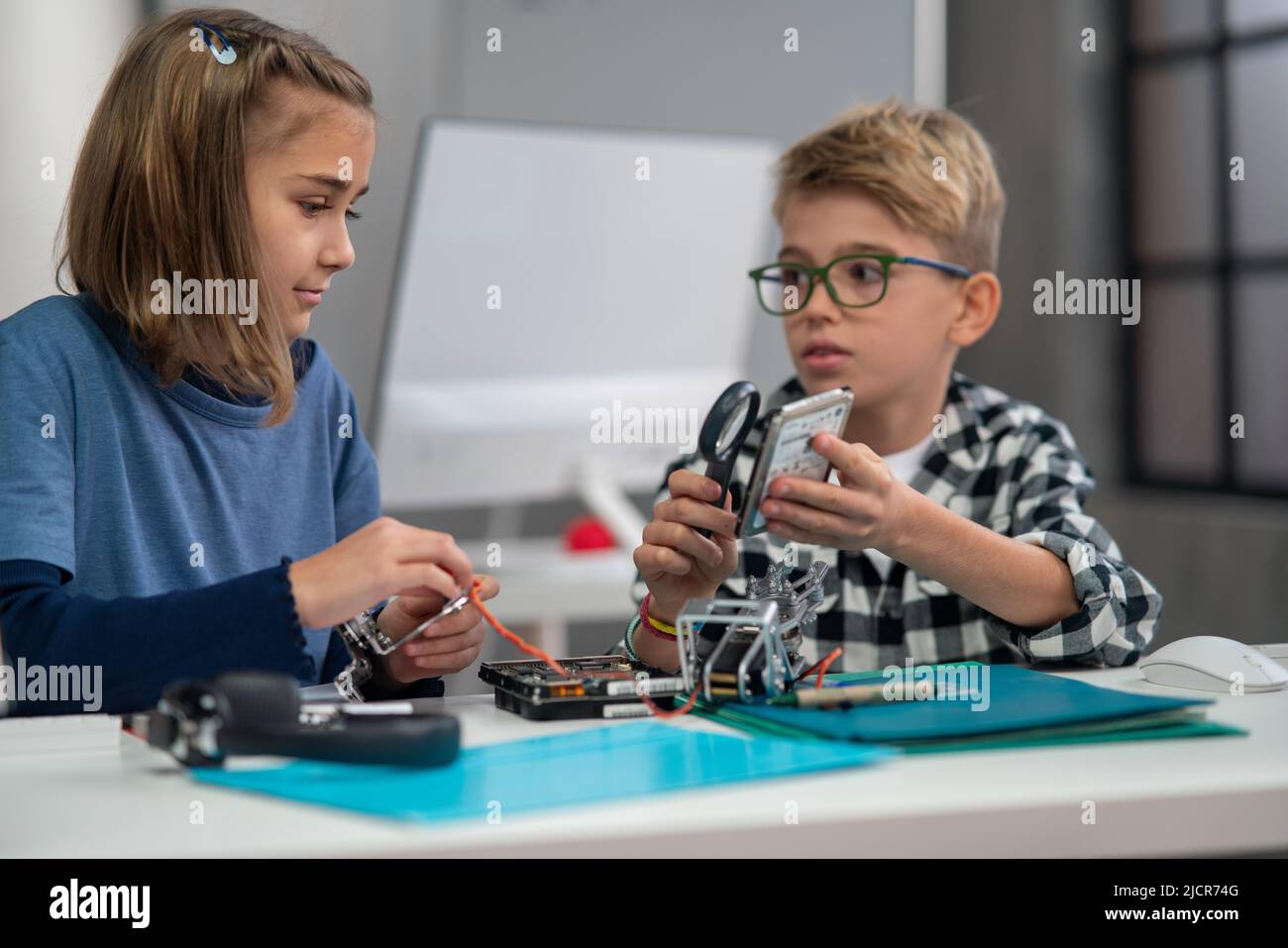 Pupils at school working with electronics component at robotics ...