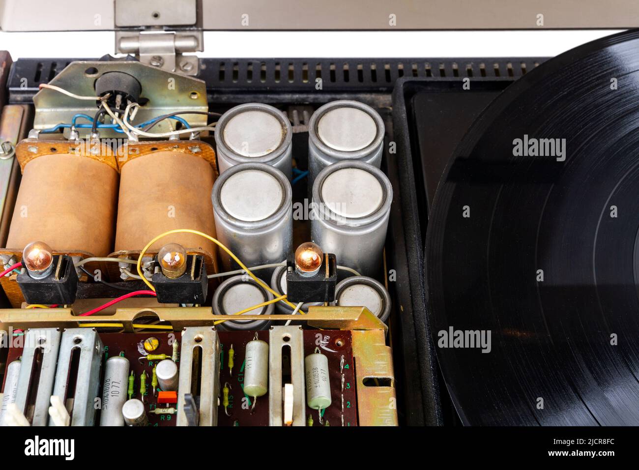 Inside view of turntable with amplifier, capacitors, coils and other ...