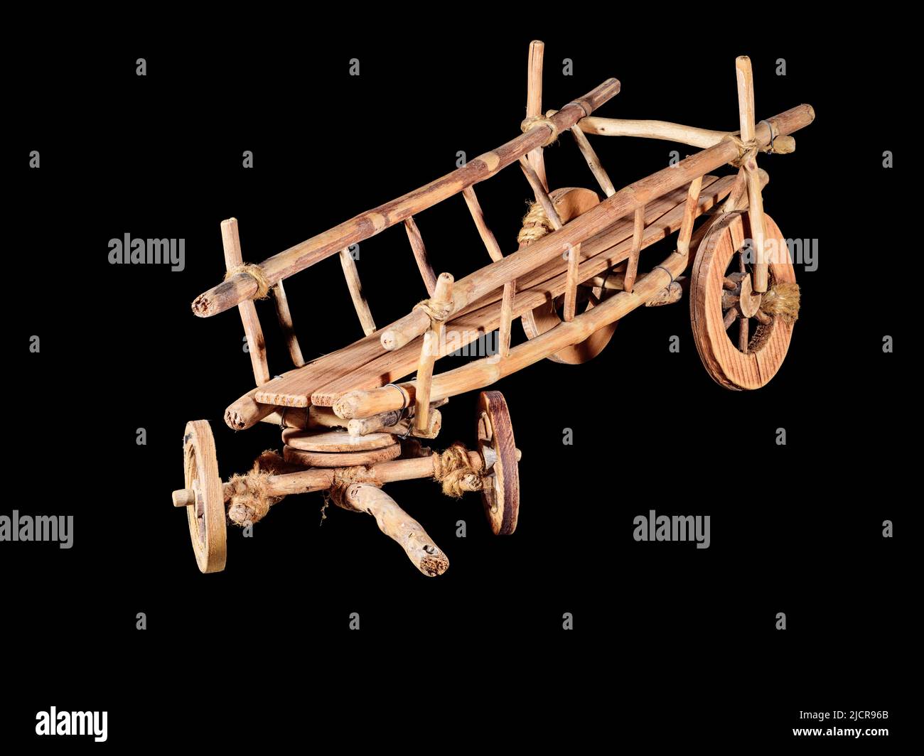 Vintage wooden cart model isolated on black background Stock Photo - Alamy