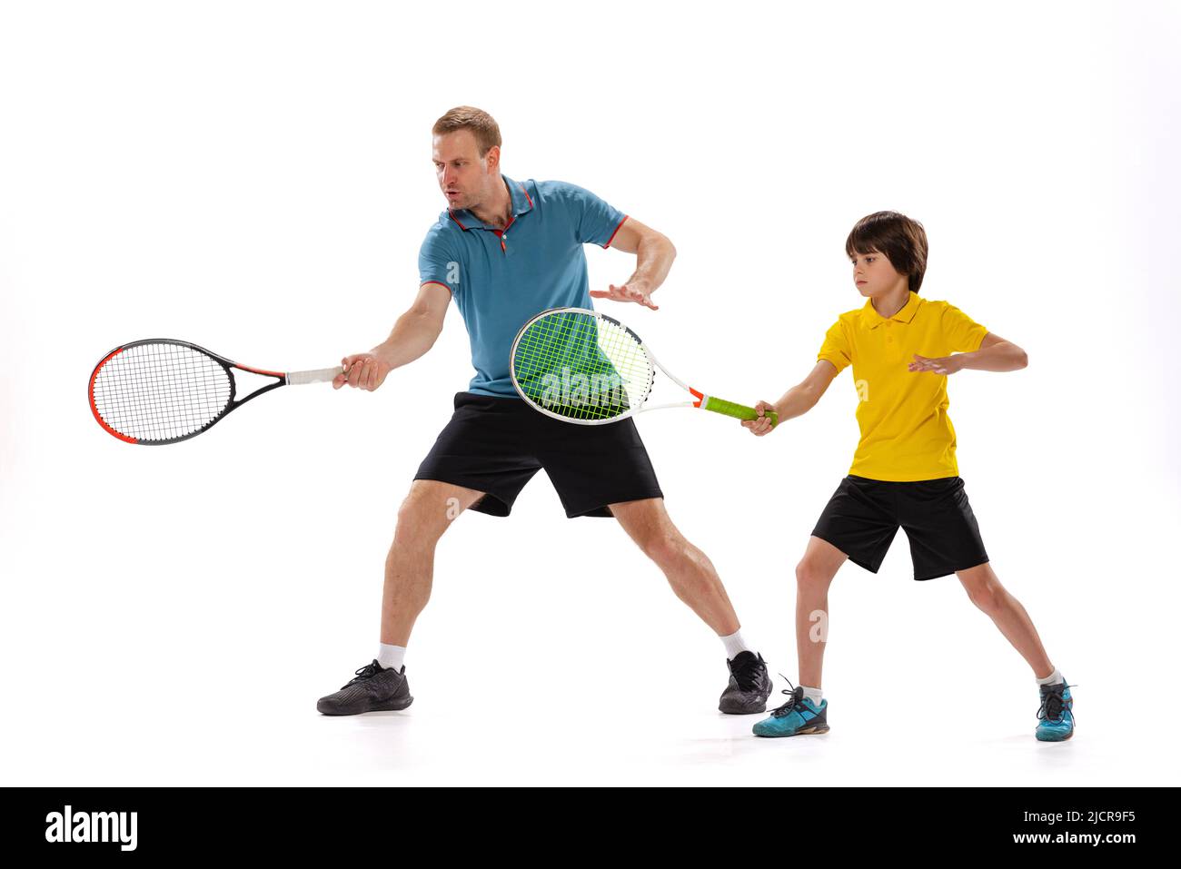 Tennis lesson. Professional tennis player, instructor shows basic ...
