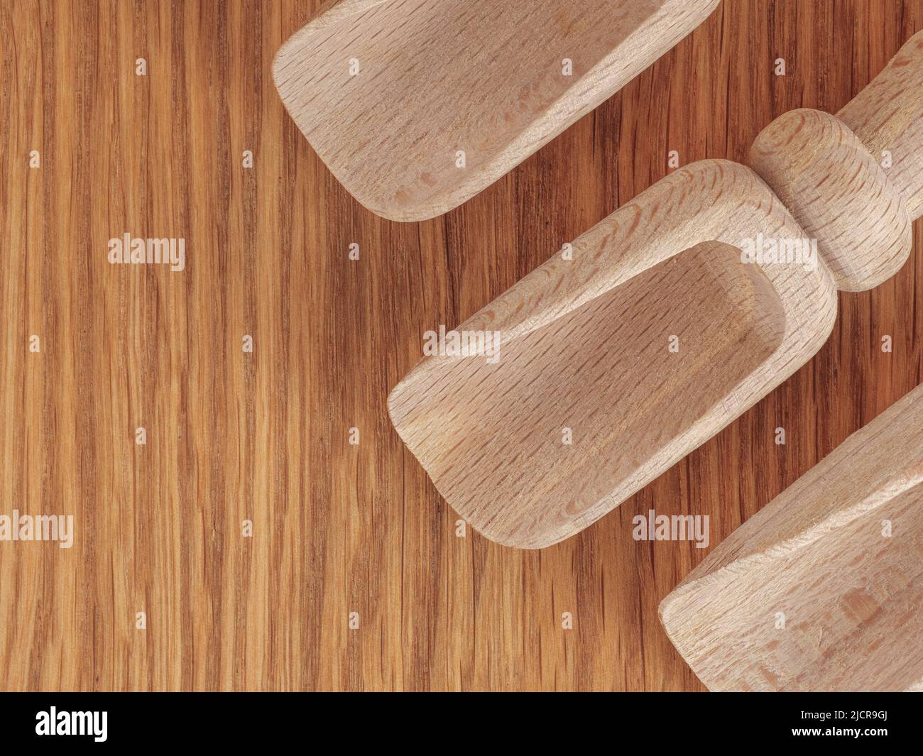 Wooden scoops shovels for spices and bulk products top view close up ...