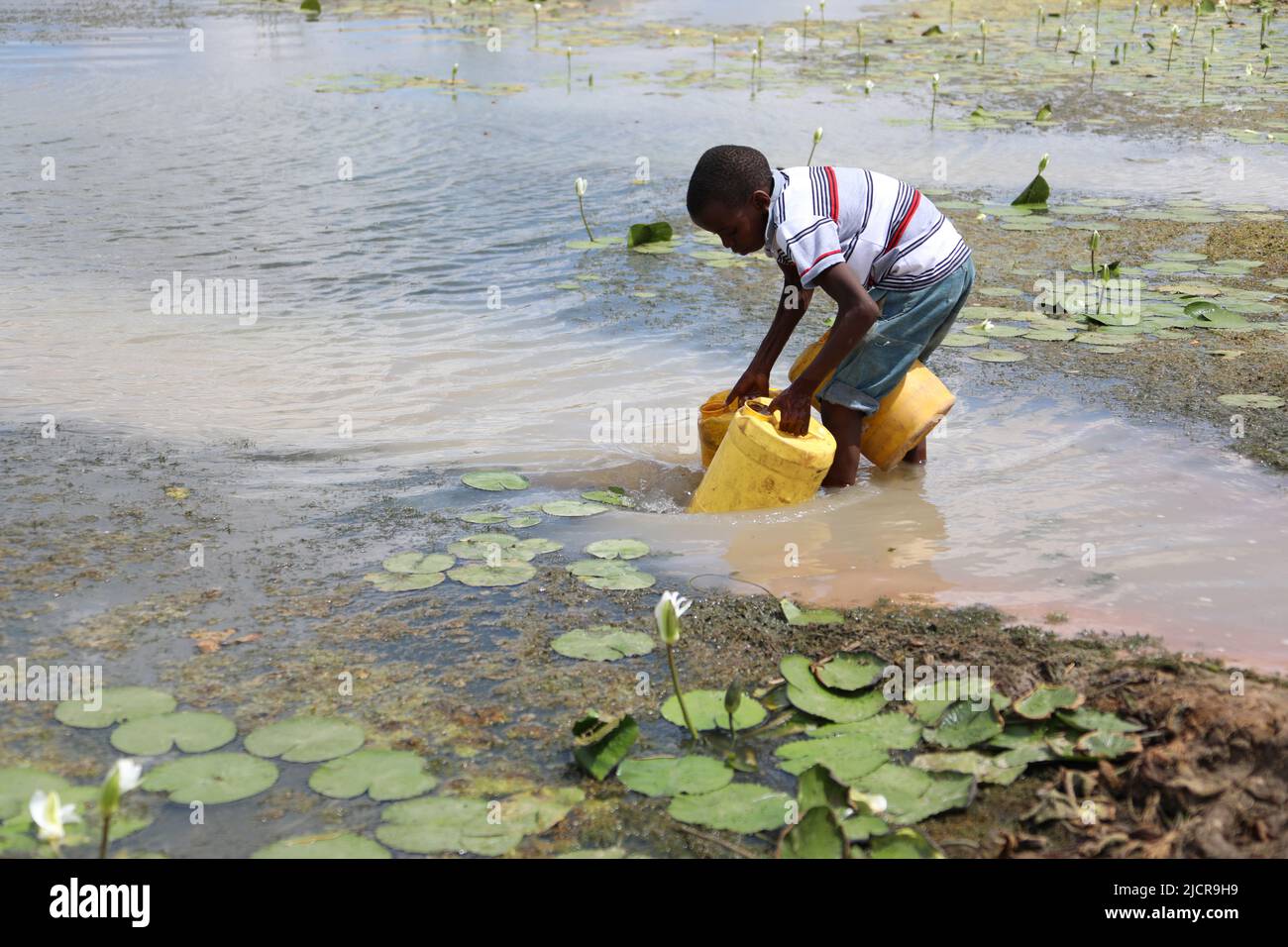 Kilifi, Kenya. 23rd Mar, 2022. A boy fetches water in Kidemu sub ...