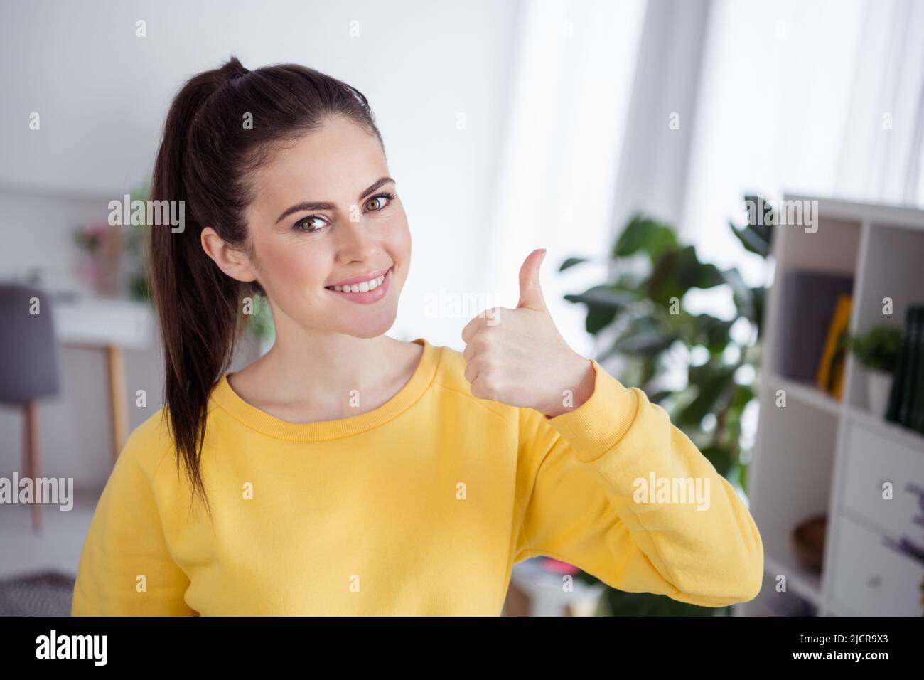 Photo of cheerful nice lady toothy smile arm demonstrate thumb up yes ...