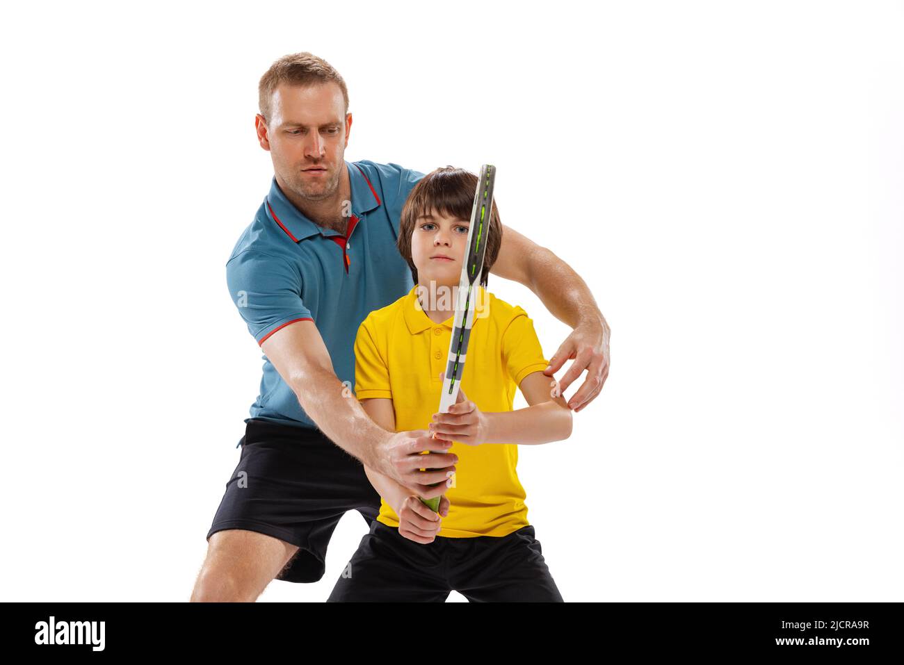 Tennis lesson. Professional tennis player, instructor shows basic ...