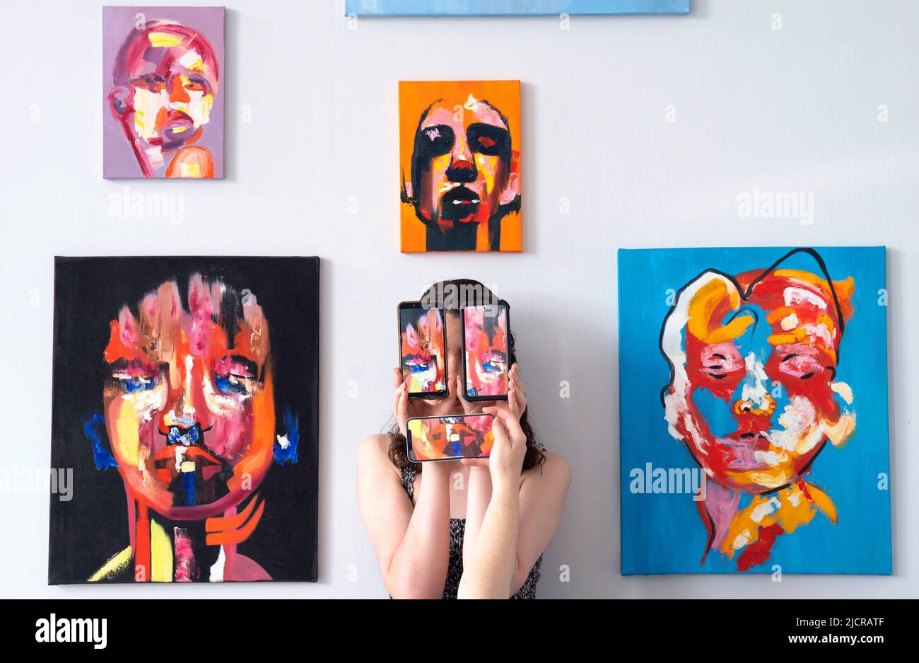 Curator Florence Kitching, is pictured with a collection of art works ...