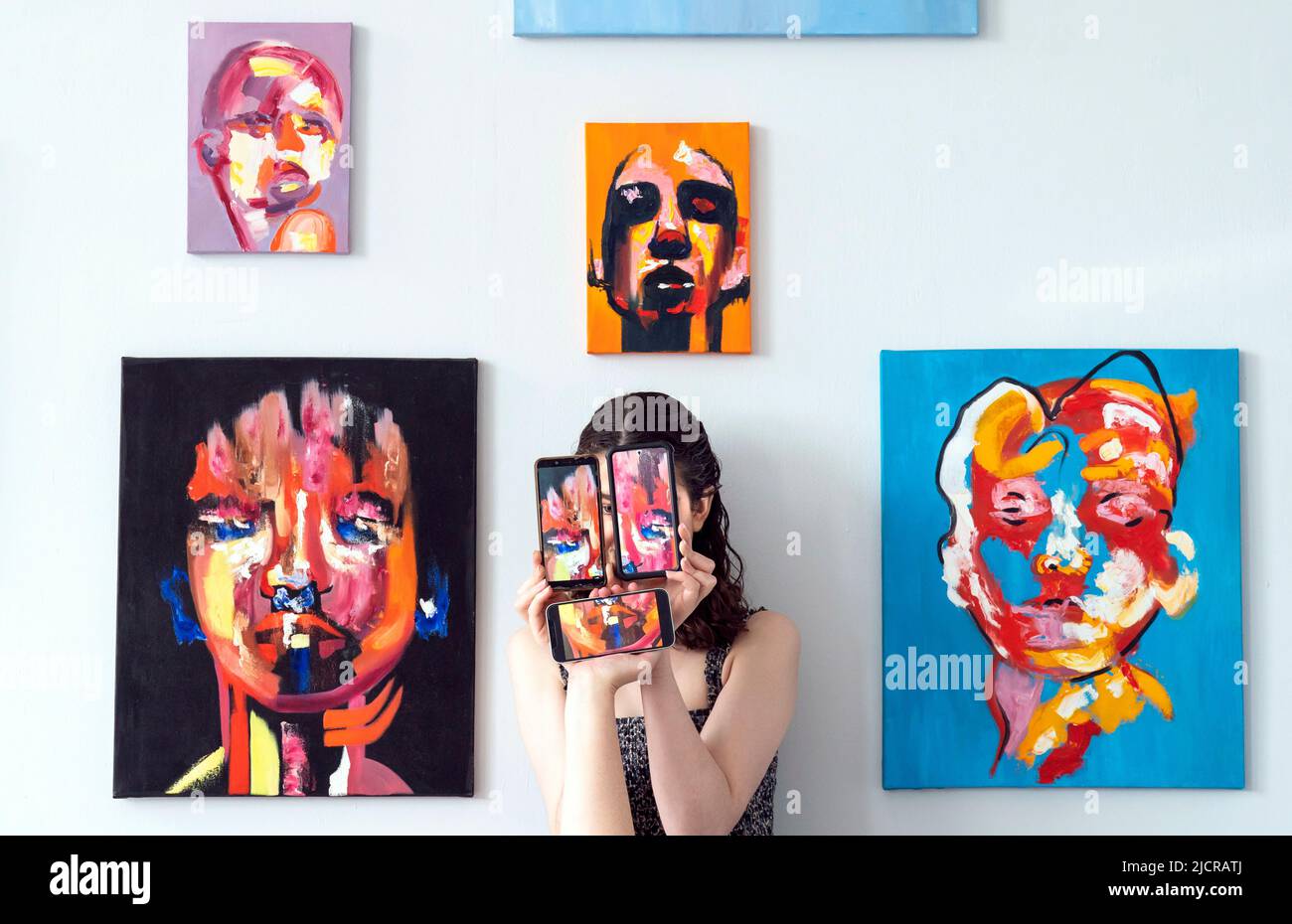 Curator Florence Kitching, is pictured with a collection of art works ...