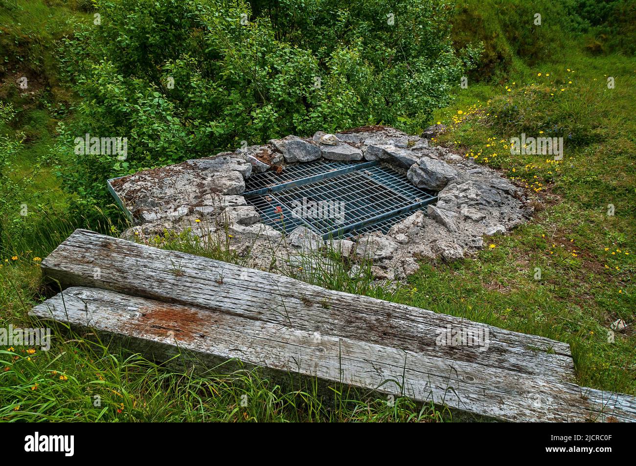 Safety grille over a very deep and old lead mine shaft from the 18th ...