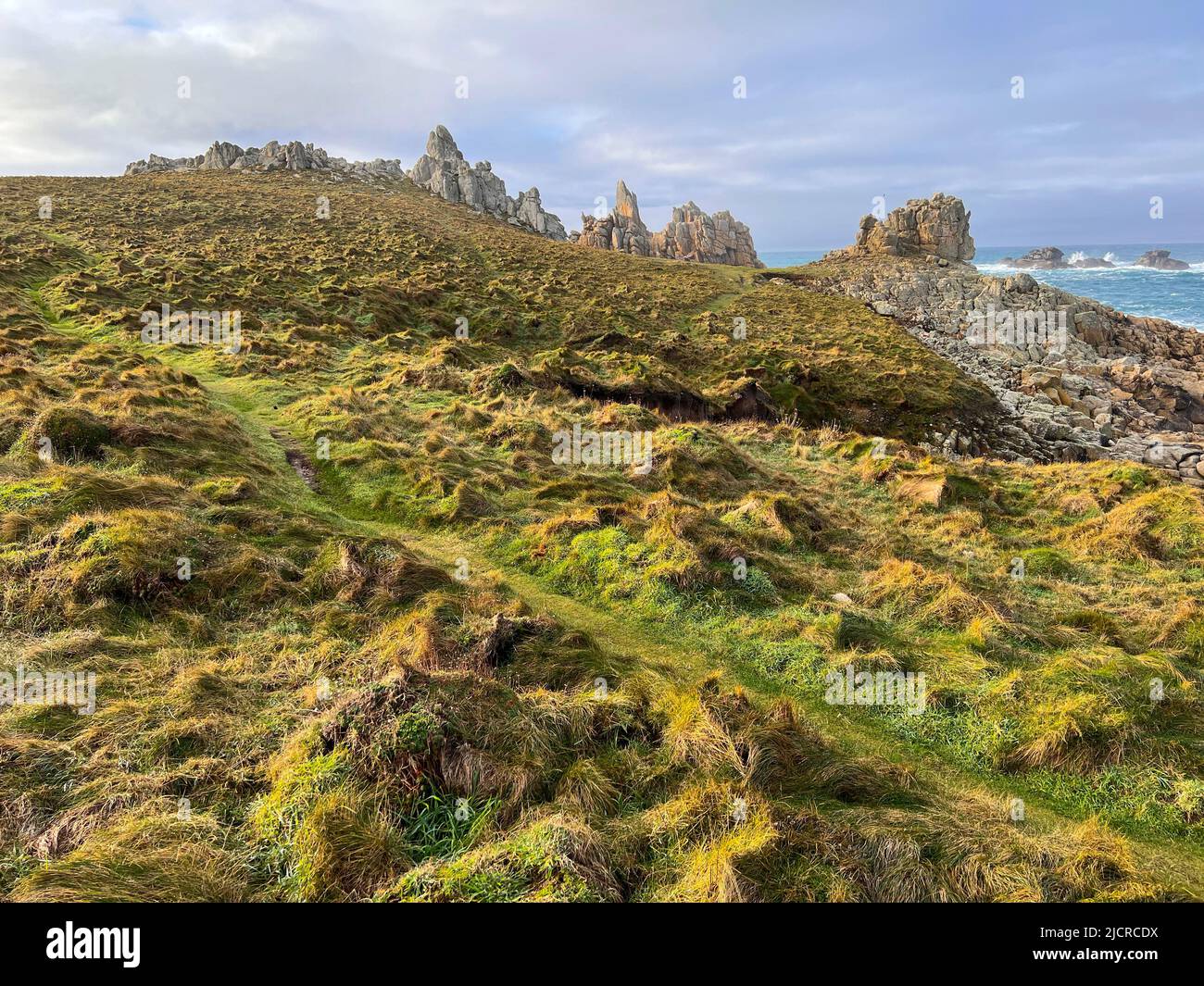 Hiking trail on green grass, Ushan countryside scenery with sea and ...