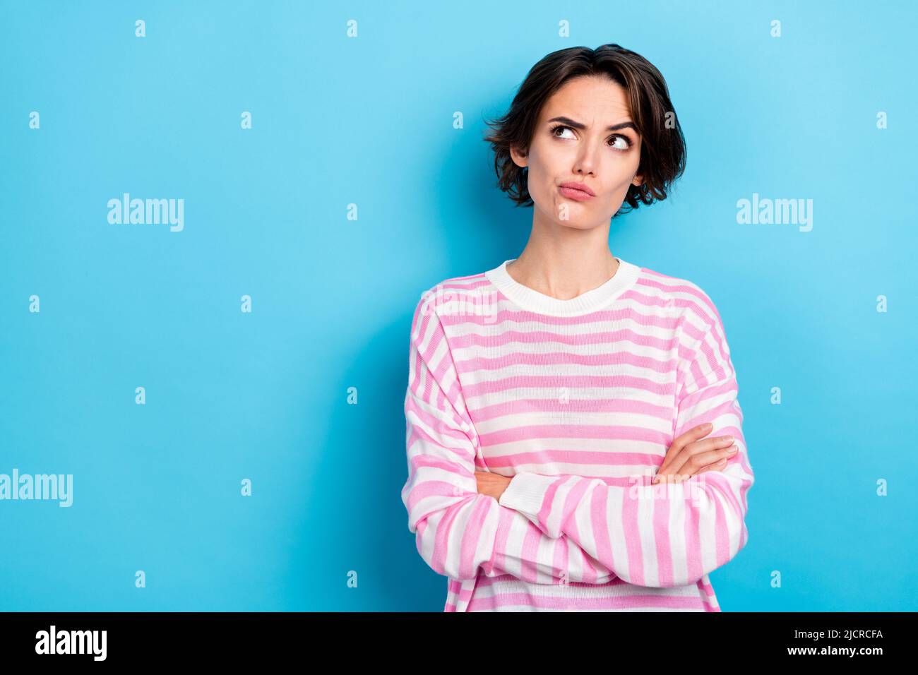 Photo of young serious charming girl look empty space contemplate solve ...