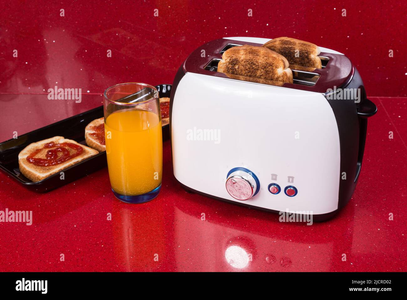 Modern design of the bread toaster in the red kitchen interior Stock ...