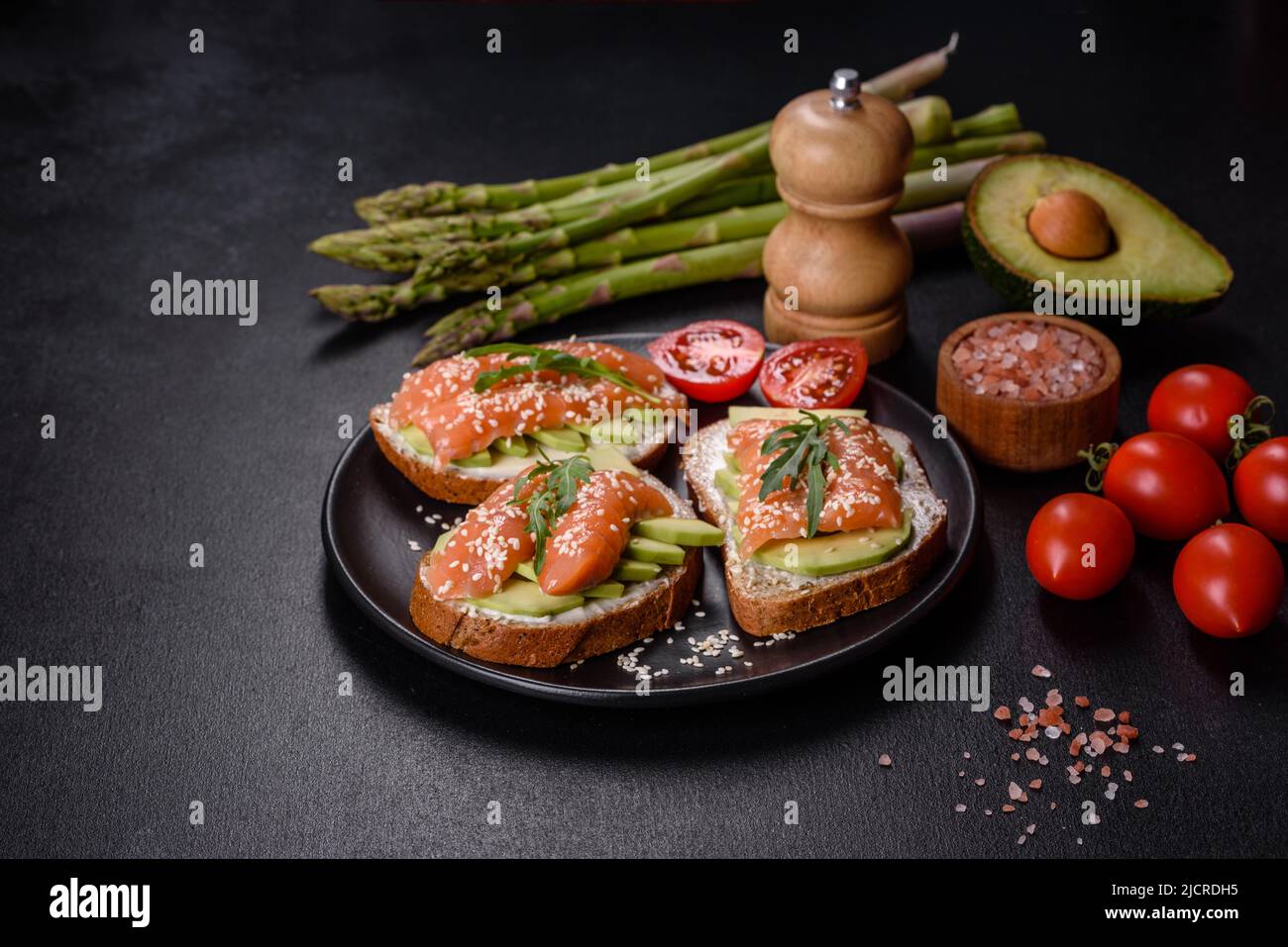 Open sandwich or toast. Grain bread with salmon, avocado and sesame ...