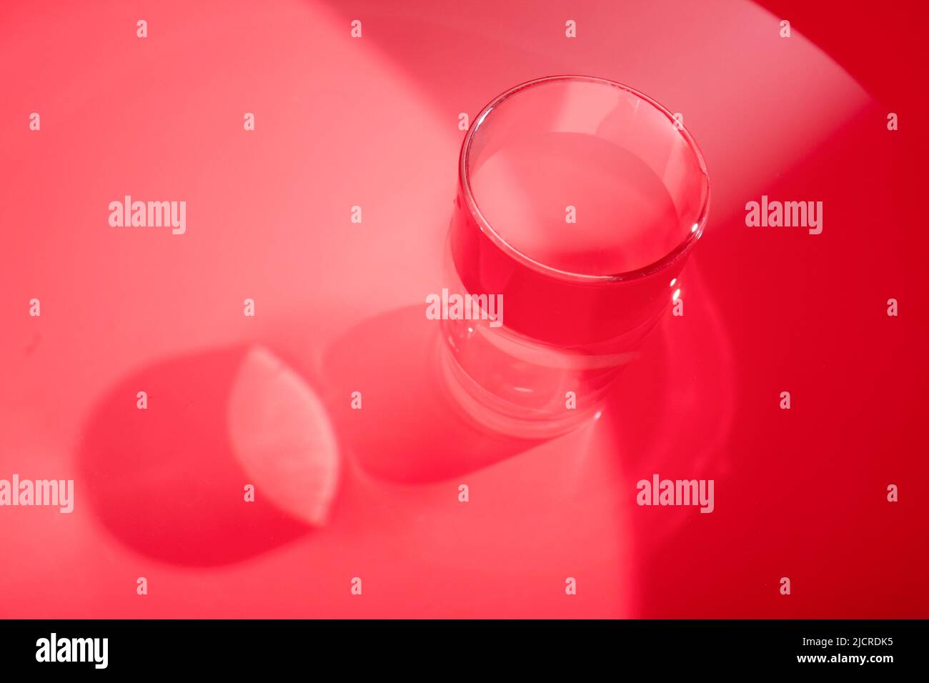 Abstract red background with a glass. Glass object in blur Stock Photo ...