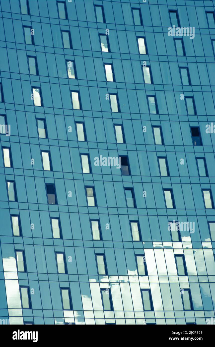 Blue sky and clouds reflected on modern mirrored building facade Stock ...