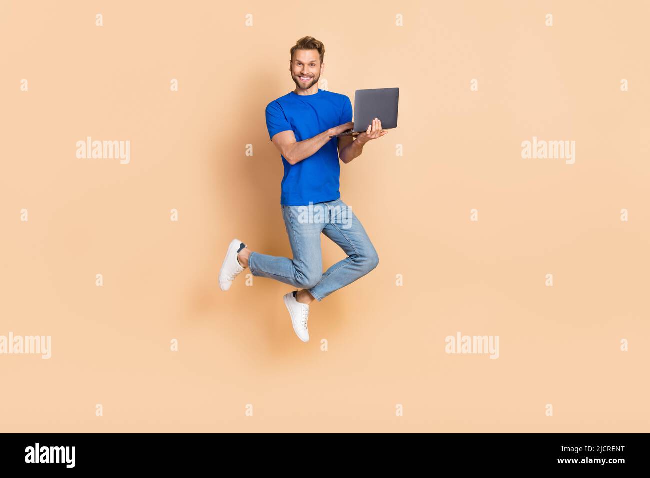 Full size photo of excited energetic person use wireless netbook ...