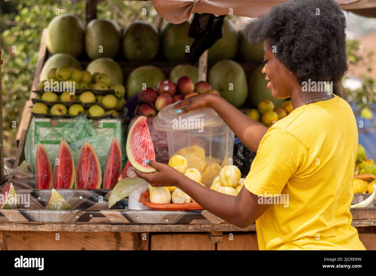 portrait of young african woman selling fruits Stock Photo - Alamy