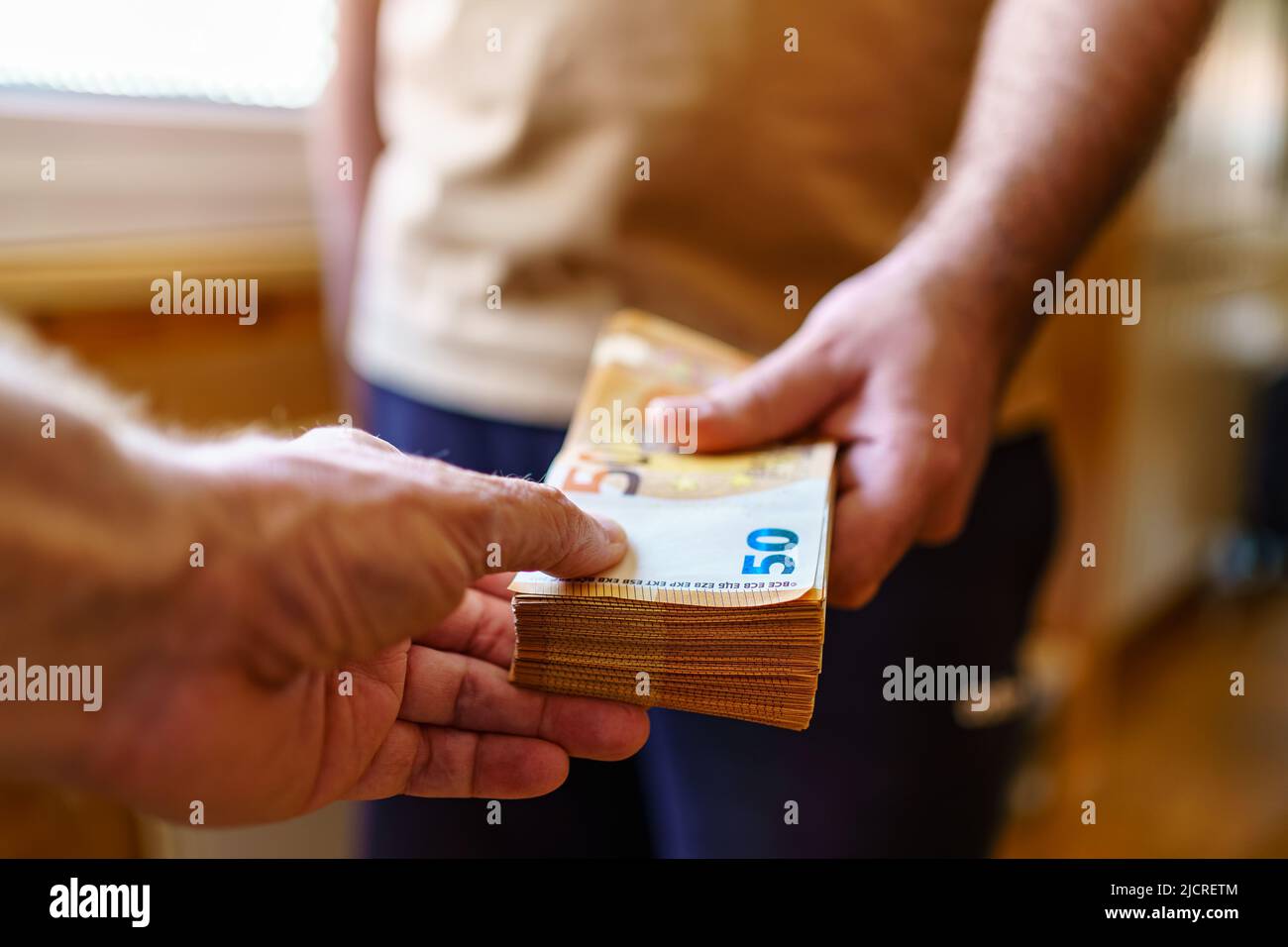Handing over money hi-res stock photography and images - Alamy