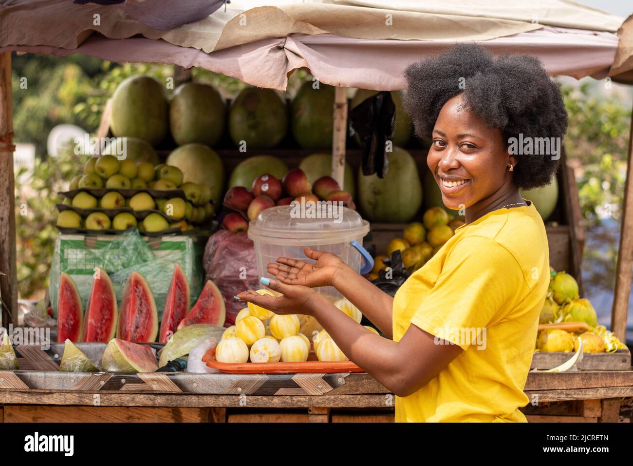 portrait of young african woman selling fruits Stock Photo - Alamy