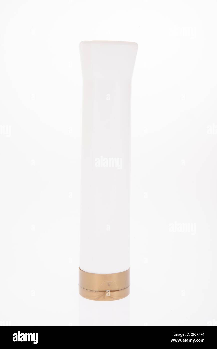 Multipurpose container; white plastic jar with golden lid - photo on ...