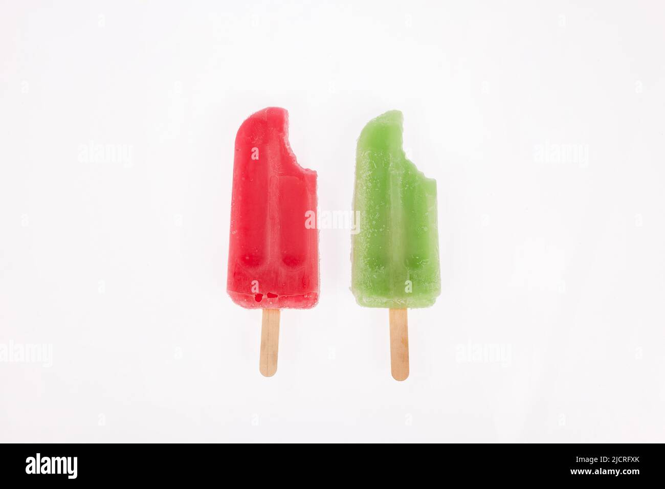Two tasty and refreshing popsicles on white background Stock Photo - Alamy