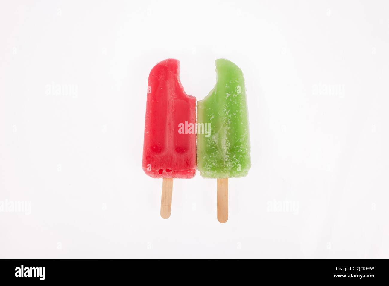 Two tasty and refreshing popsicles on white background Stock Photo - Alamy