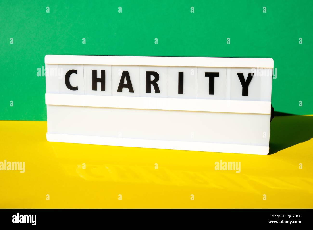 Lightbox with text CHARITY. Motivational Words Quotes Concept. Colorful ...