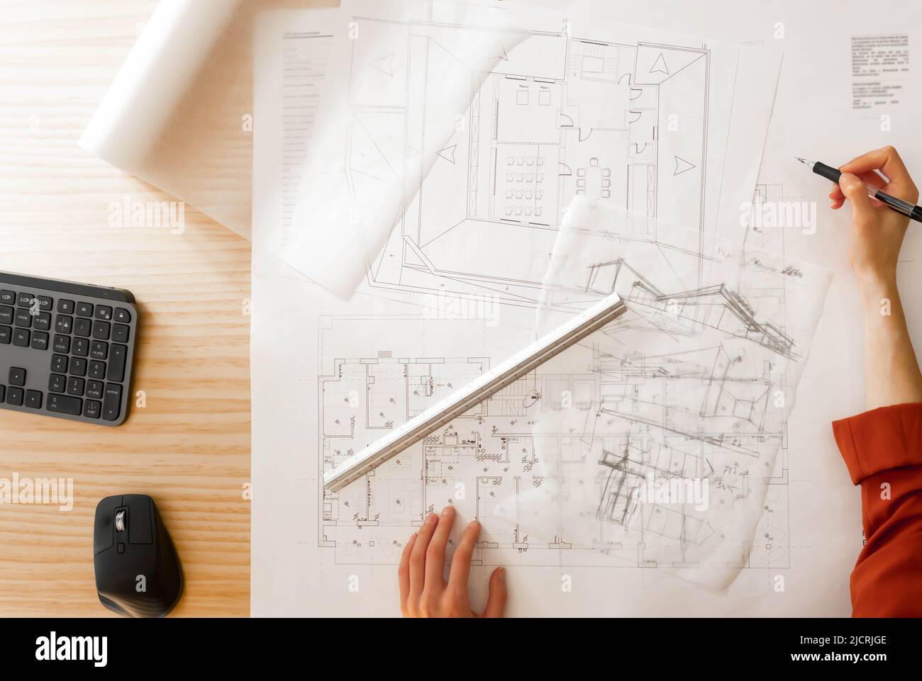 Top view of architect drawing and sketching on architectural project ...