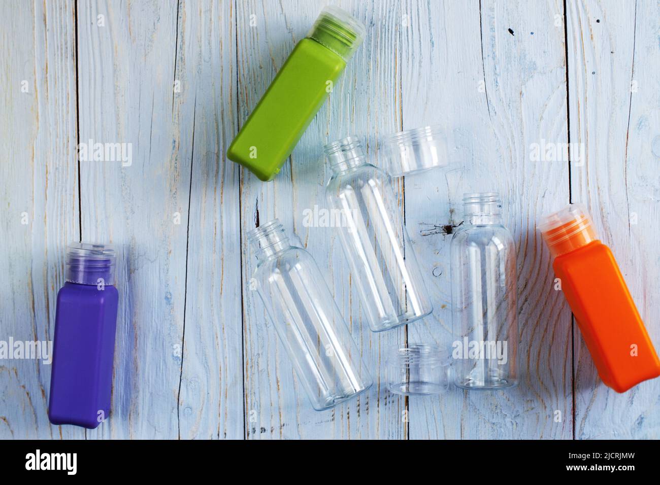 transparent plastic tube on a blue wooden background. Plastic ...