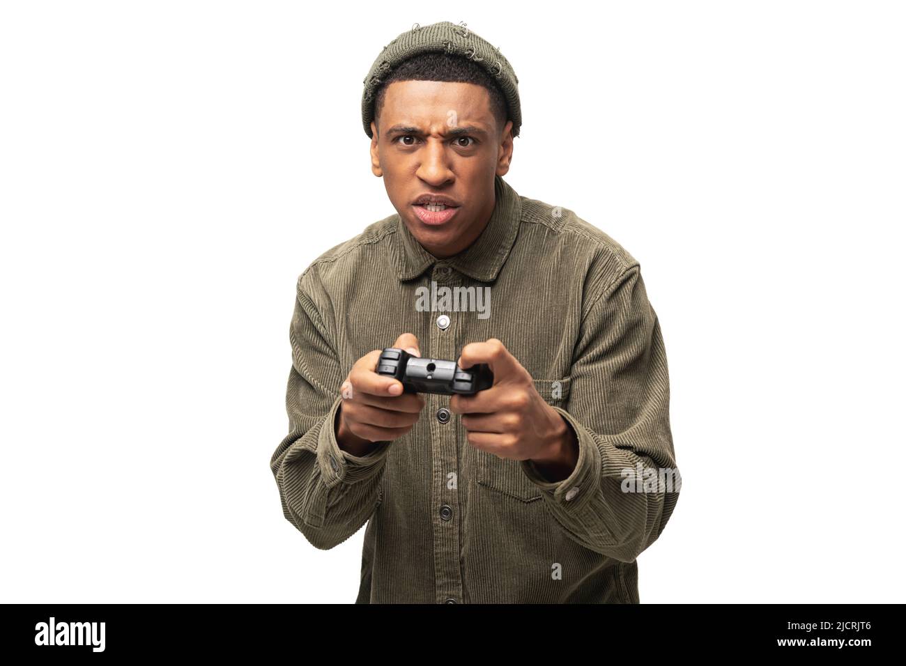 Confused young Latin man isolated over white background, playing video ...