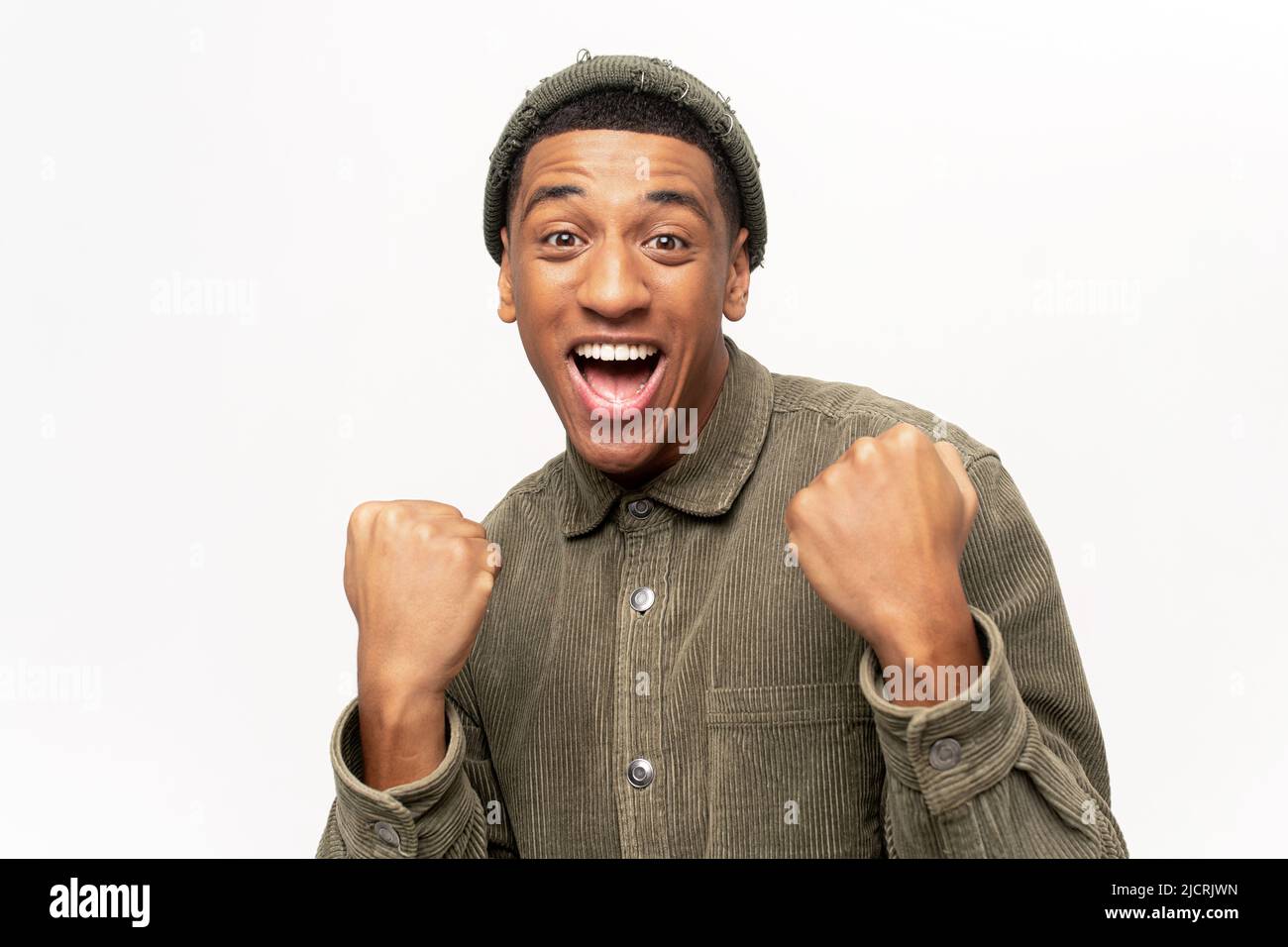 Excited overjoyed man shouting making yes gesture, amazed with his ...