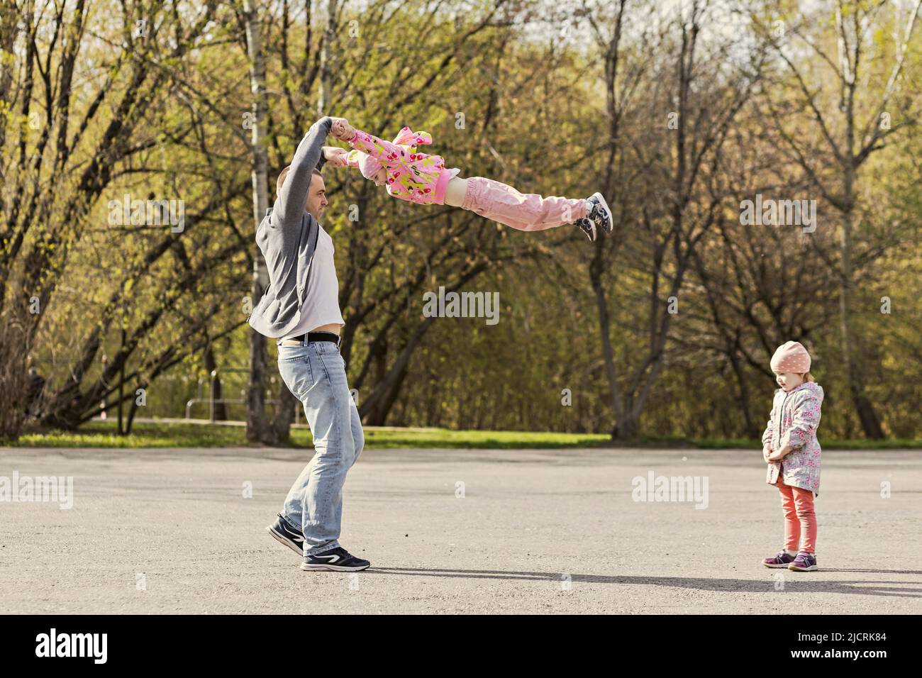 Spinning around kid hi-res stock photography and images - Alamy