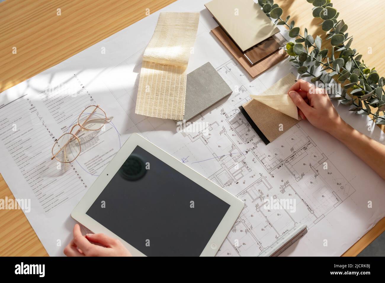 Top view of interior designer hands working on sample choosing while on ...