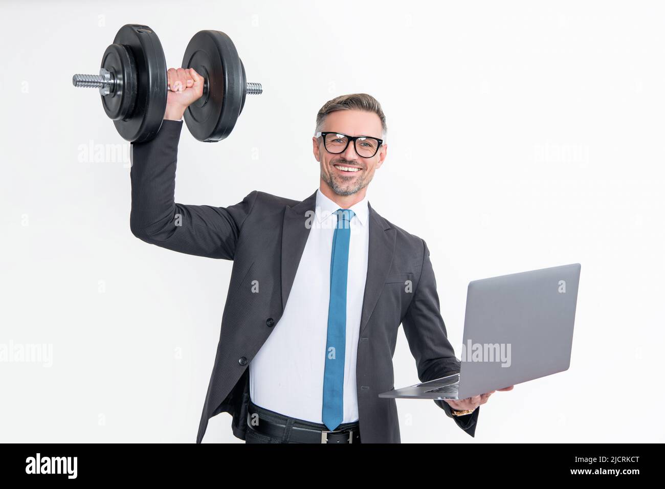 positive businessman in suit hold heavy dumbbell and laptop isolated on ...