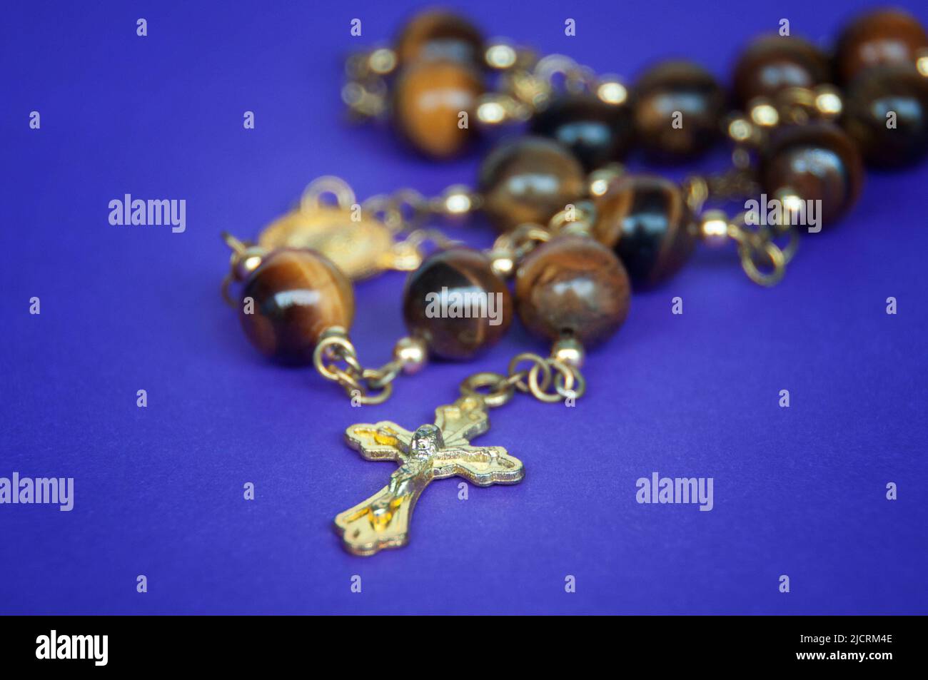 Holy Rosary on dark blue background. Religious concept. Copy space ...