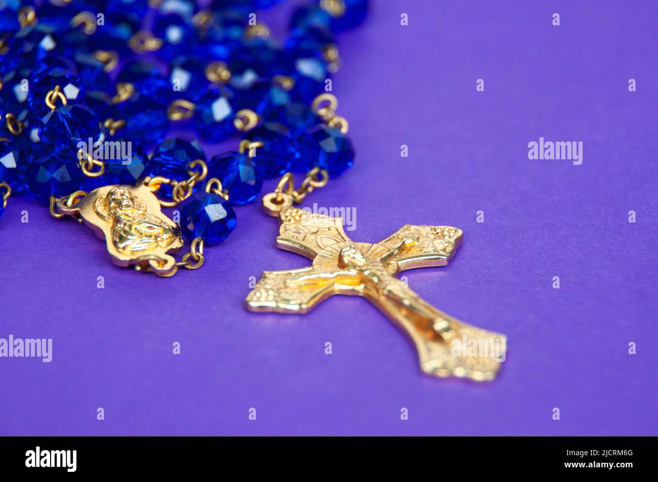 Holy Rosary on purple background. Religious concept. Copy space Stock ...