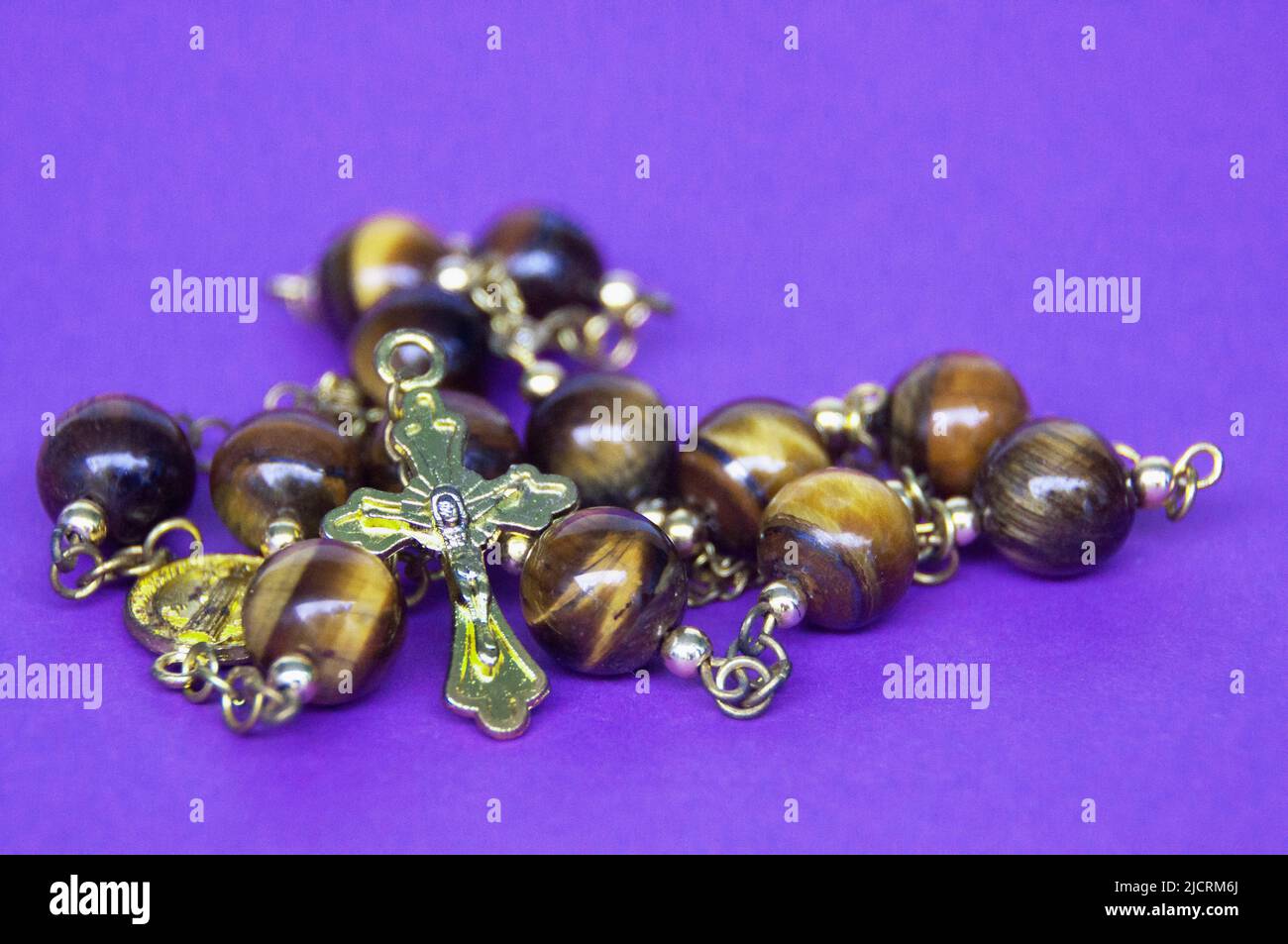 Holy Rosary on purple background. Religious concept. Copy space Stock ...