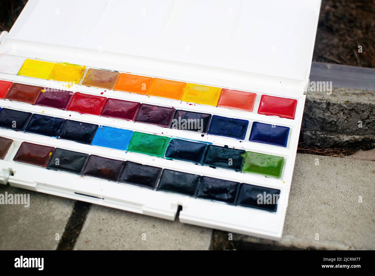 Set of watercolor paints. Watercolor for sketching in nature. Selective ...