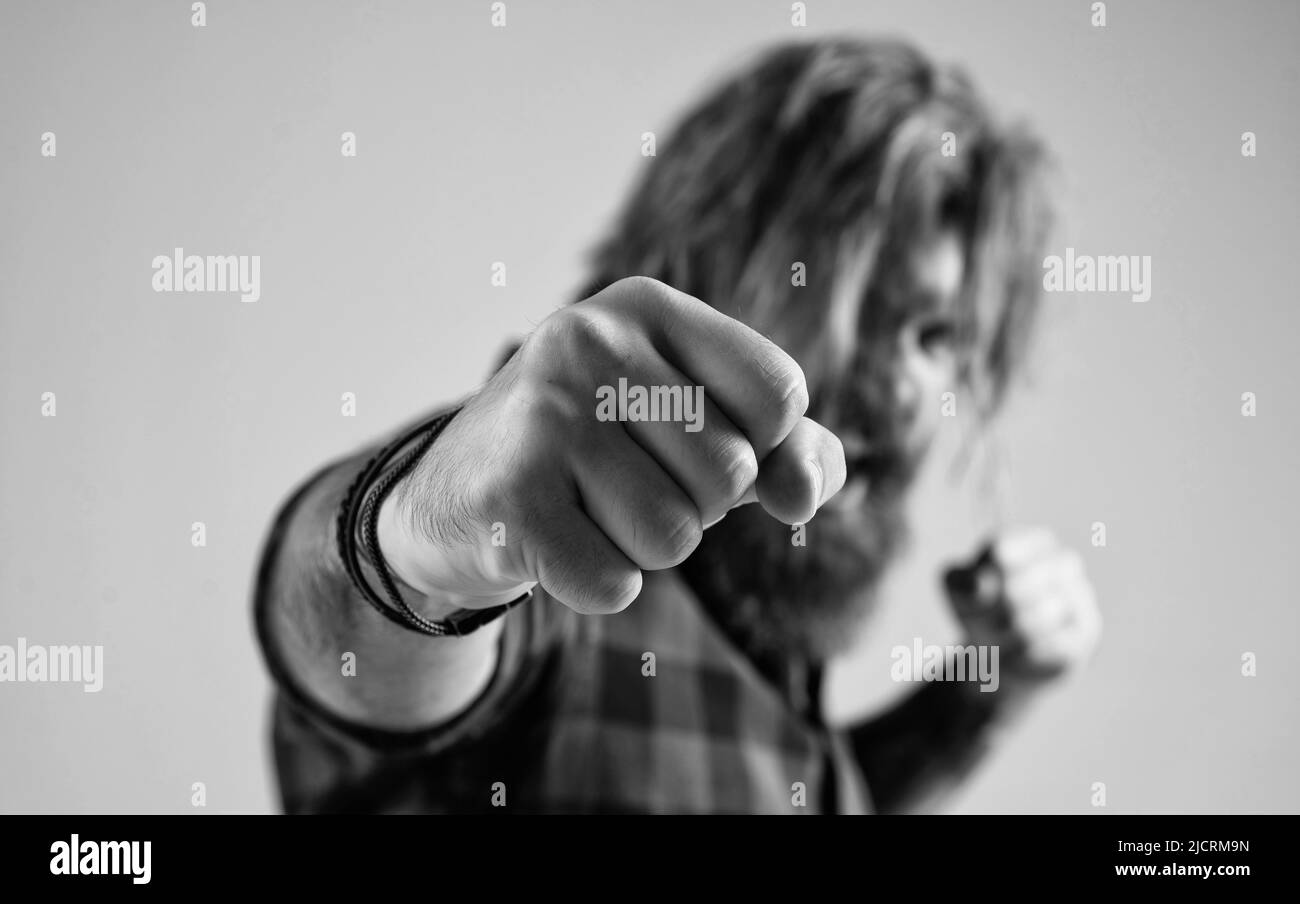 just one hit. bearded man punching with fist. boxing concept. negative ...