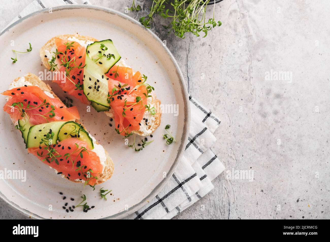 Sandwiches. Salmon toast with cream cheese, cucumber, black sesame and ...