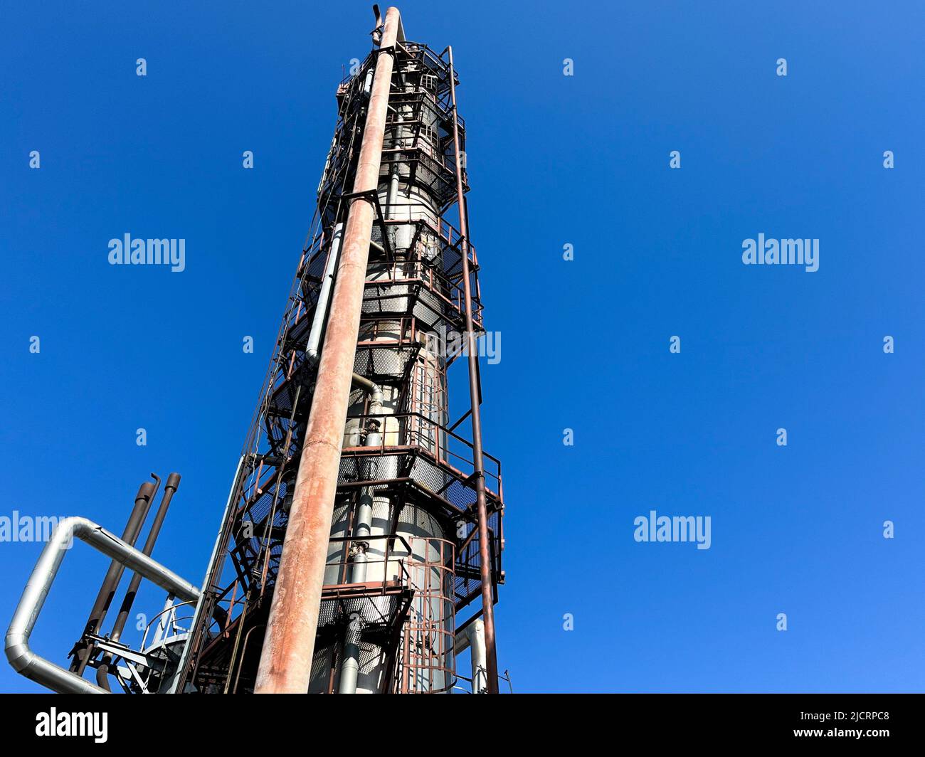 The main distillation column of oil and petroleum products in close-up ...