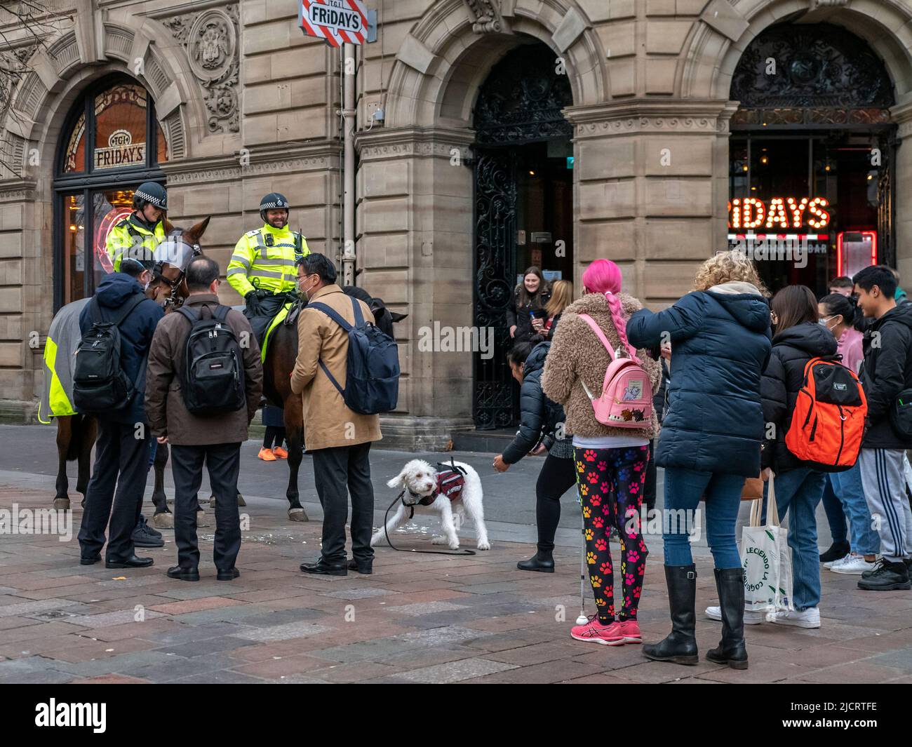 Glasgow, Scotland. UK. November 4th, 2021: A group of people talking to ...