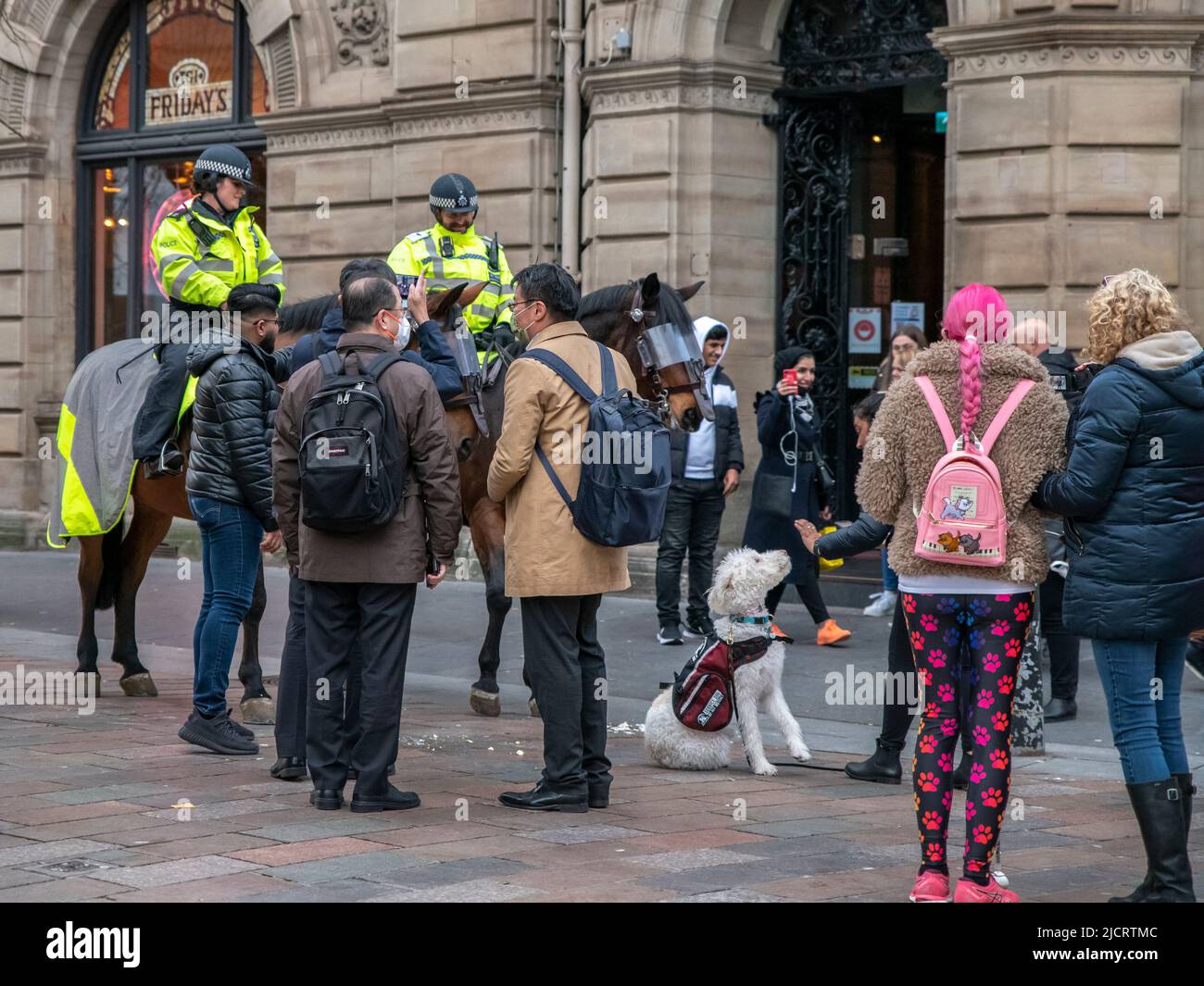 Glasgow, Scotland. UK. November 4th, 2021: A group of people talking to ...