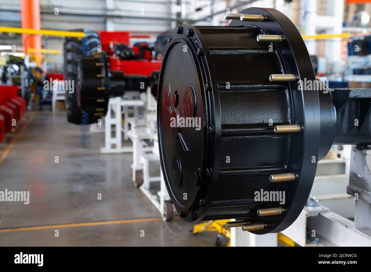 Close up disassembled tractor reduction axle on modern tractor at ...