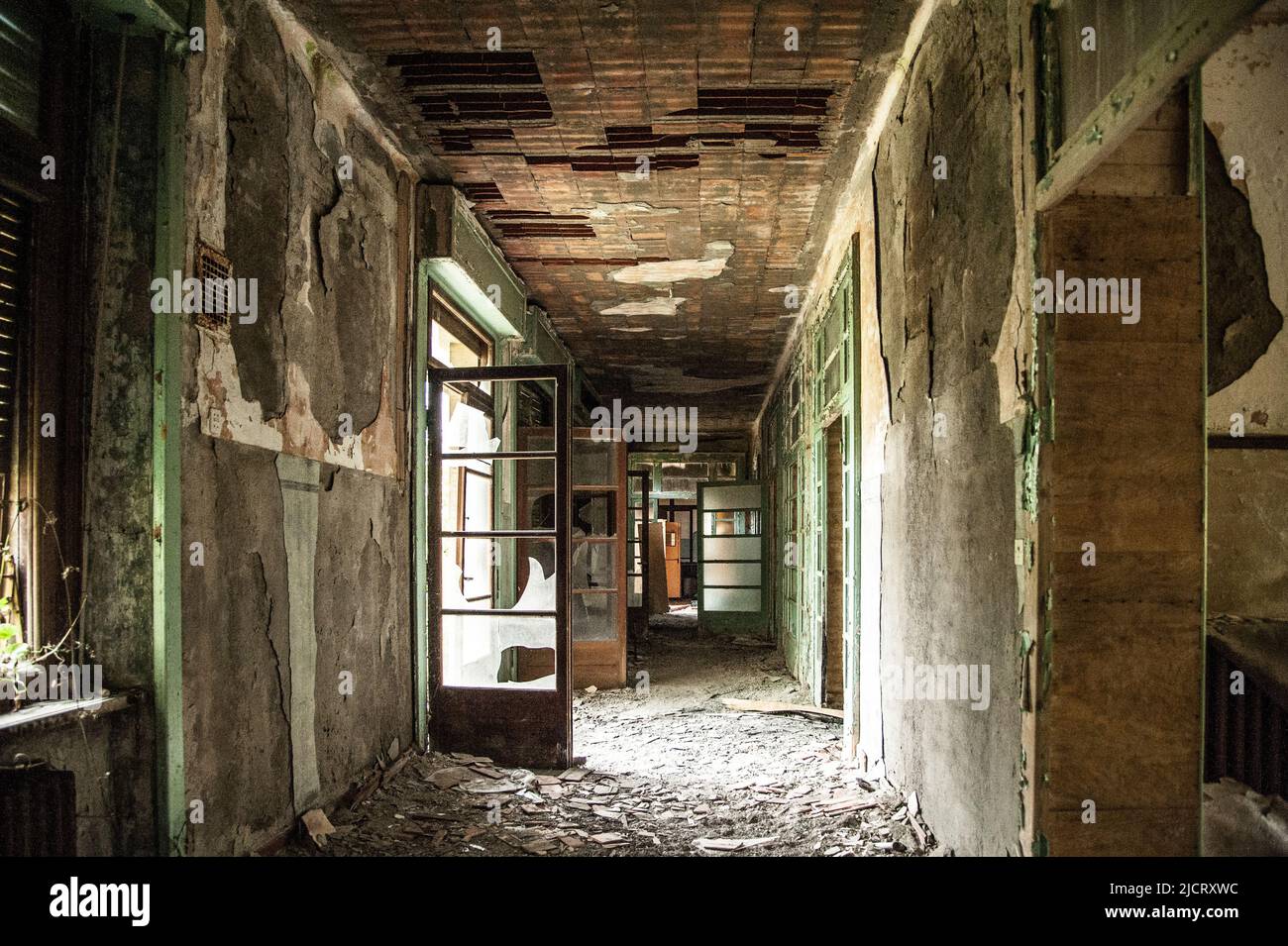 July 2022, Italy. Urbex in Italy. Dilapidated corridor of an abandoned ...