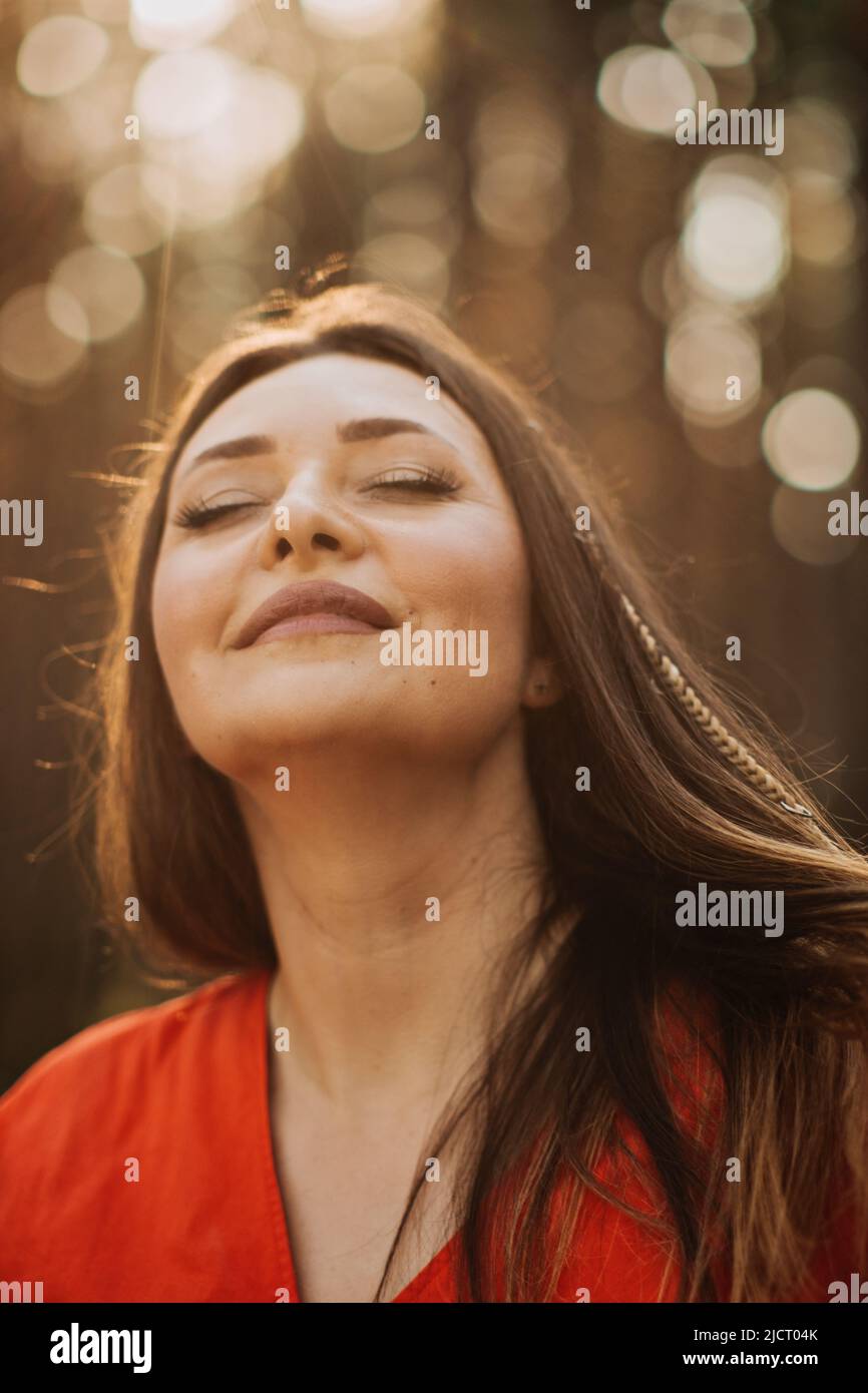 Outdoor portrait of beautiful smiling woman in sunlight. Smiling ...